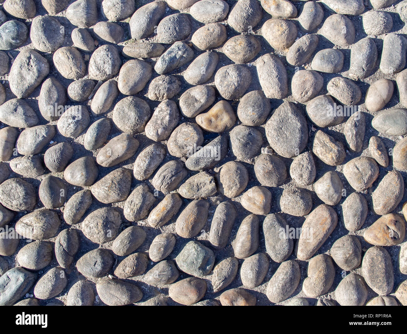 Pebbles concrete stone background hi-res stock photography and images ...