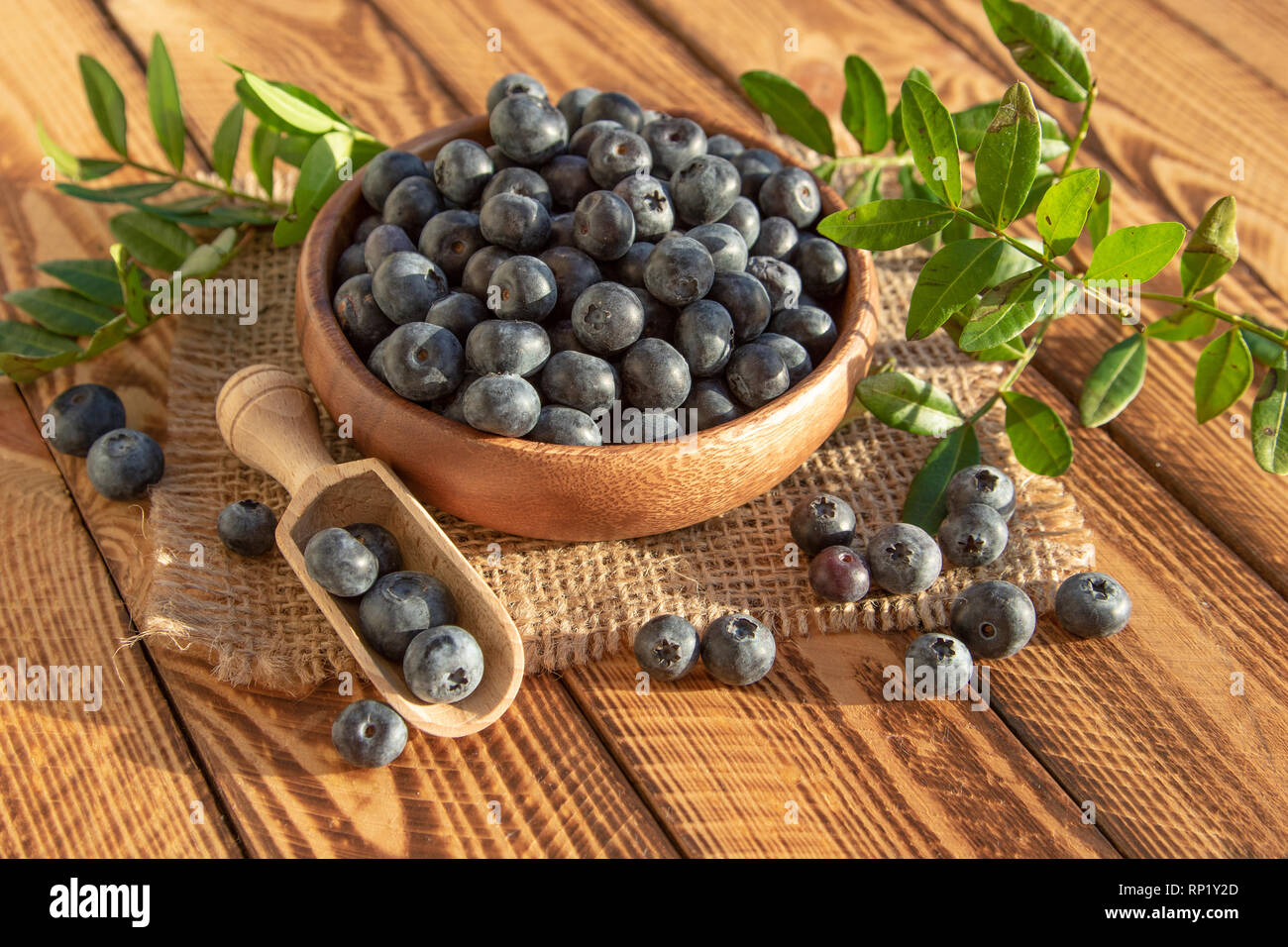 Fresh Blueberries In Wooden Bowl On Old Wooden Planks Background ...