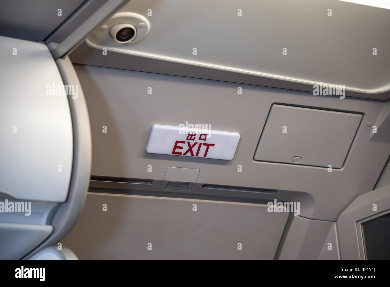 Exit lightbox signage on airplane, escape way of life. way to survive ...