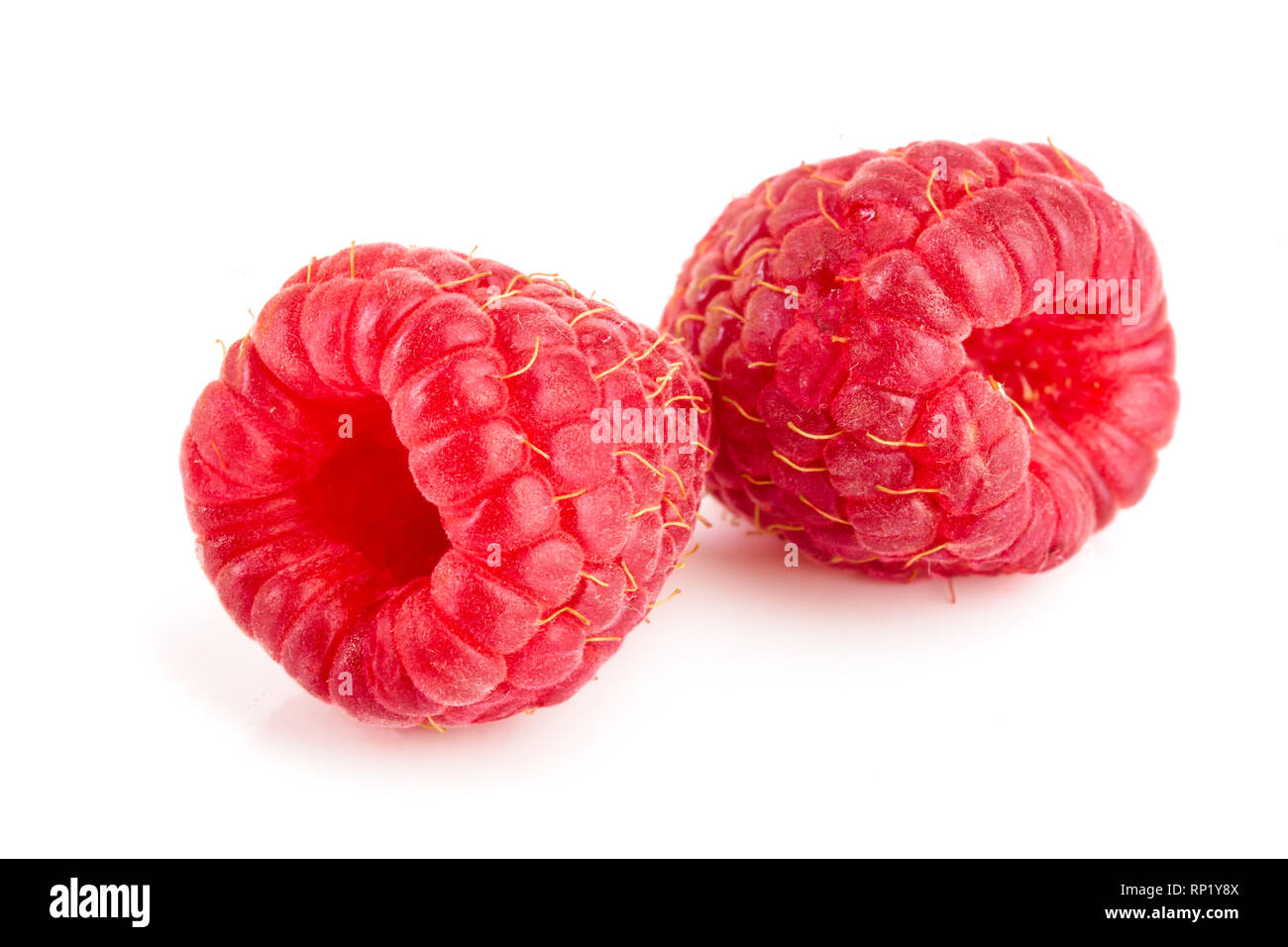 Two raspberries isolated on white background macro Stock Photo - Alamy