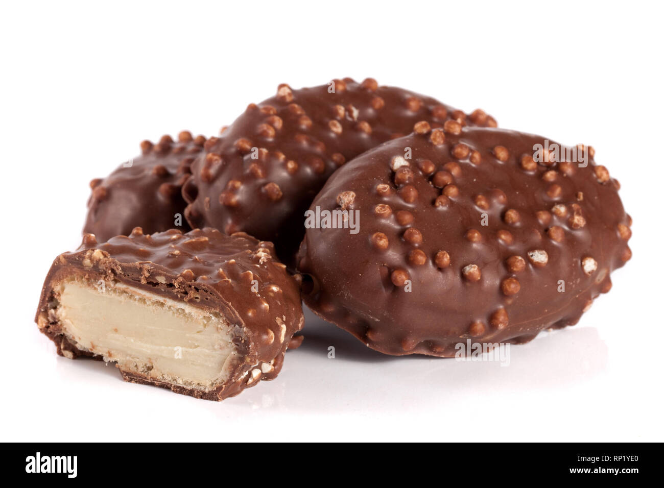 chocolate candy with white cream filling isolated on white background ...