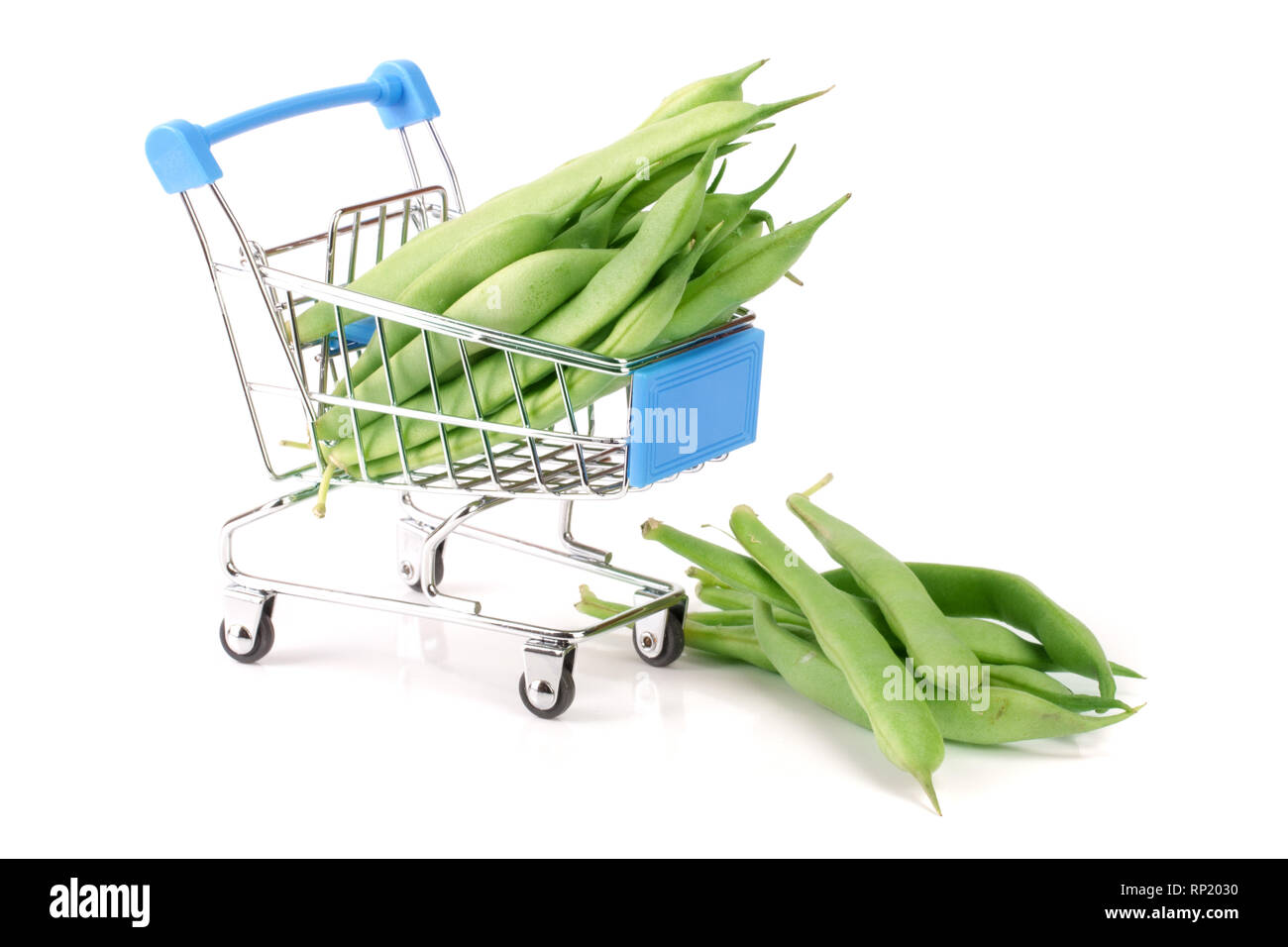 Green beans in mini shopping cart isolated on a white background Stock ...