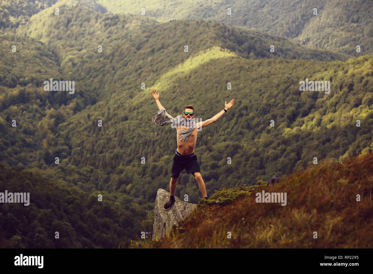 handsome guy on mountain slope Stock Photo - Alamy