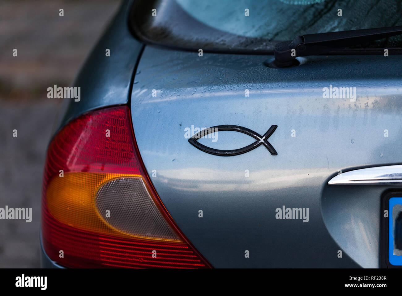 Back of the car with fish sign. Lights on the back of the car Stock ...