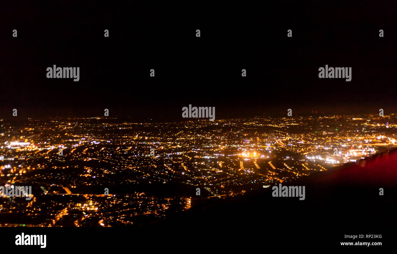 Dark background view of city with lights from aeroplane. Night lights ...