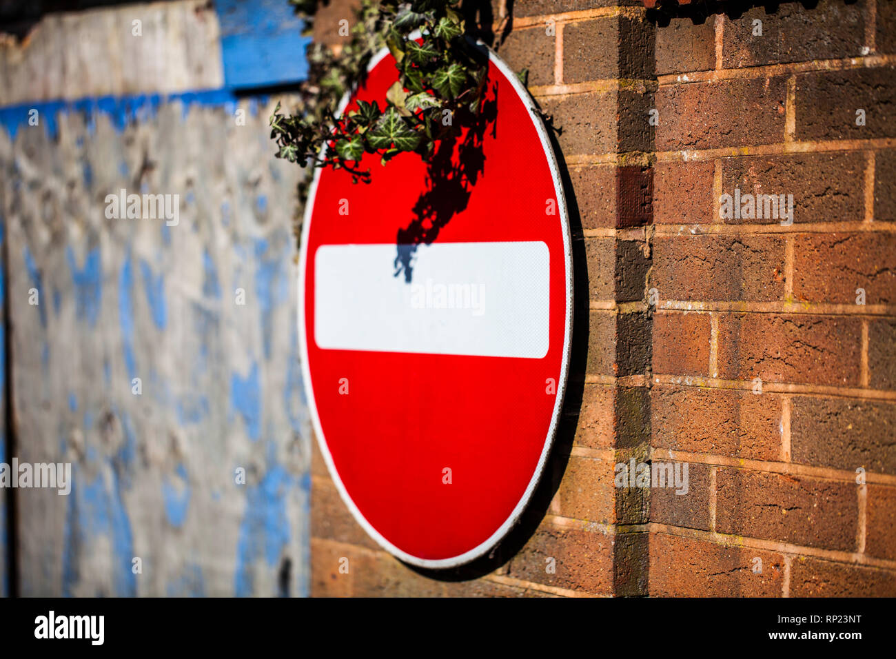 One way round sign on the wall. Traffic signs on the wall. Concept of ...