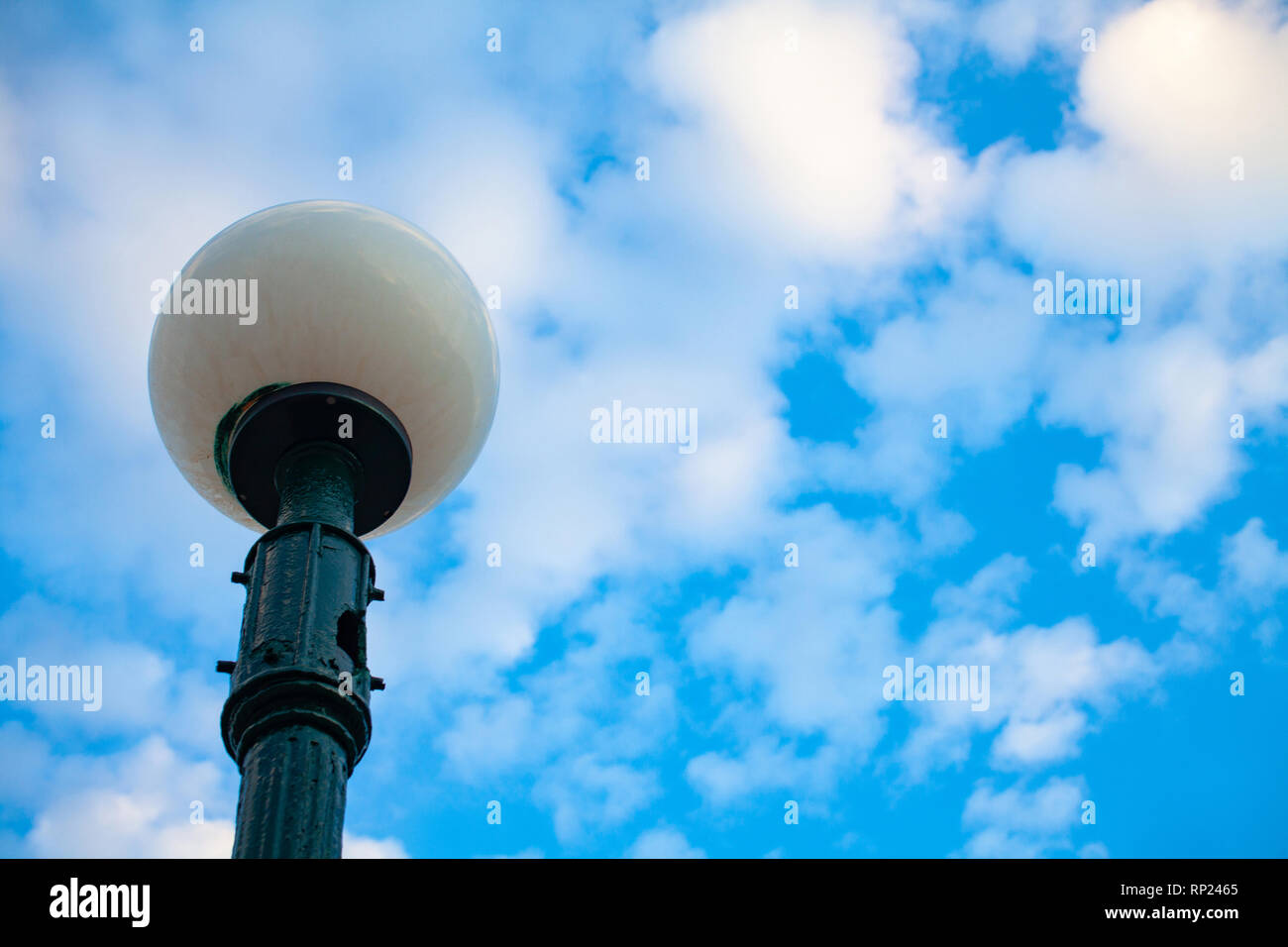 Round white ball street light bulb with cloudy sky behind Stock Photo ...
