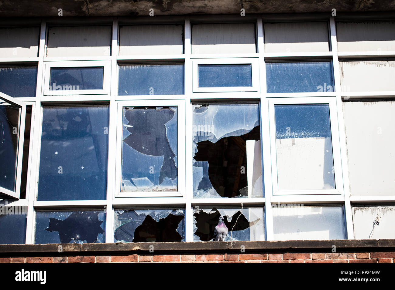 Smashed windows on the house. Broken glass on the wooden windoes. Old and demolished windows on ...