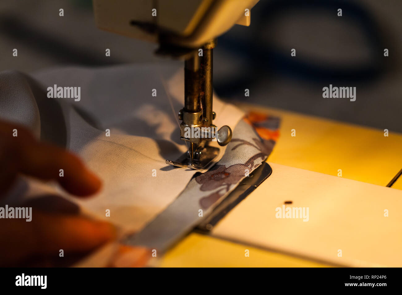 Women's hands on the sewing machine. Industry concept with creating ...