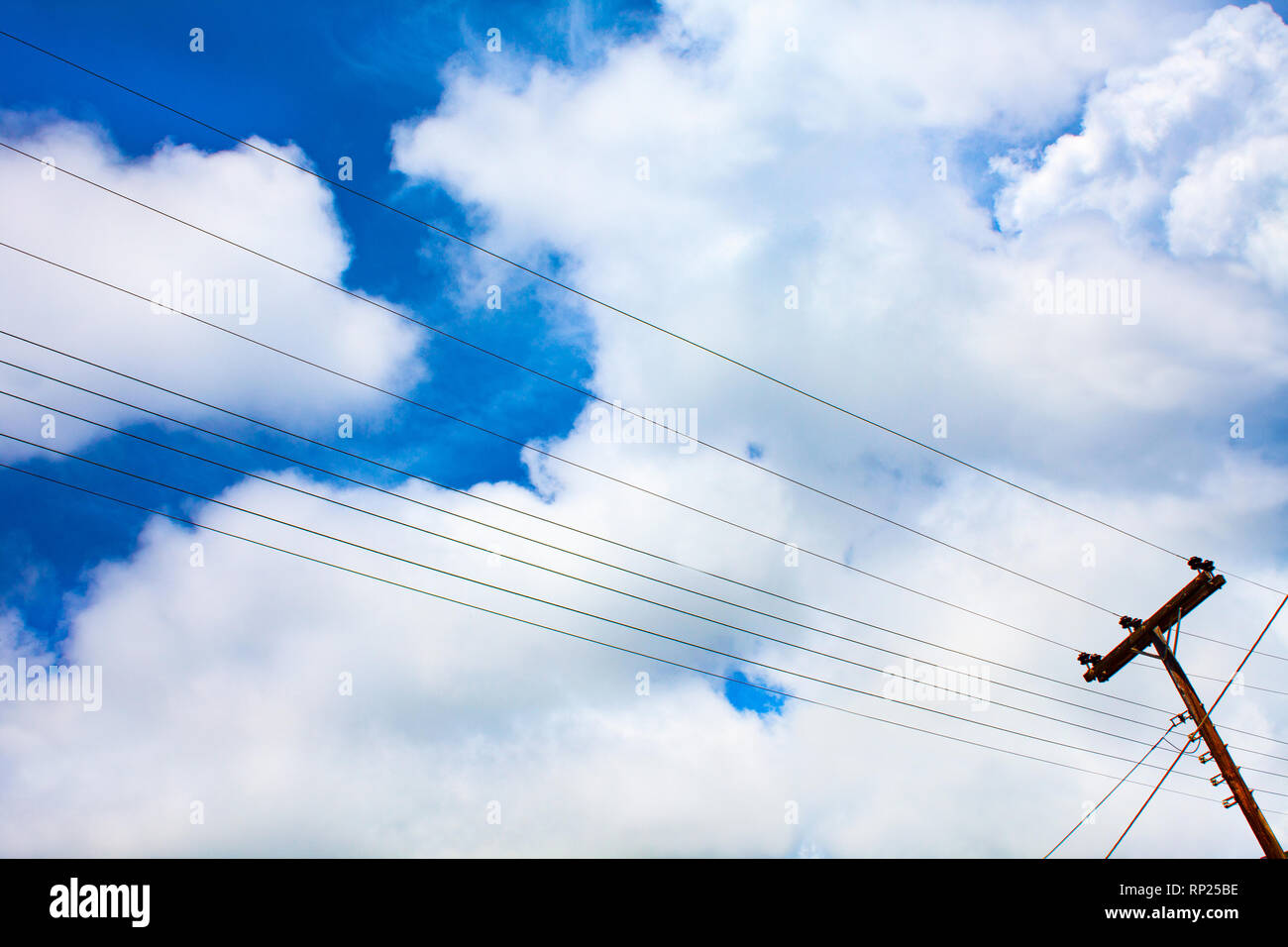 Blue sky with clouds and electricity wires. Industrial electricity ...