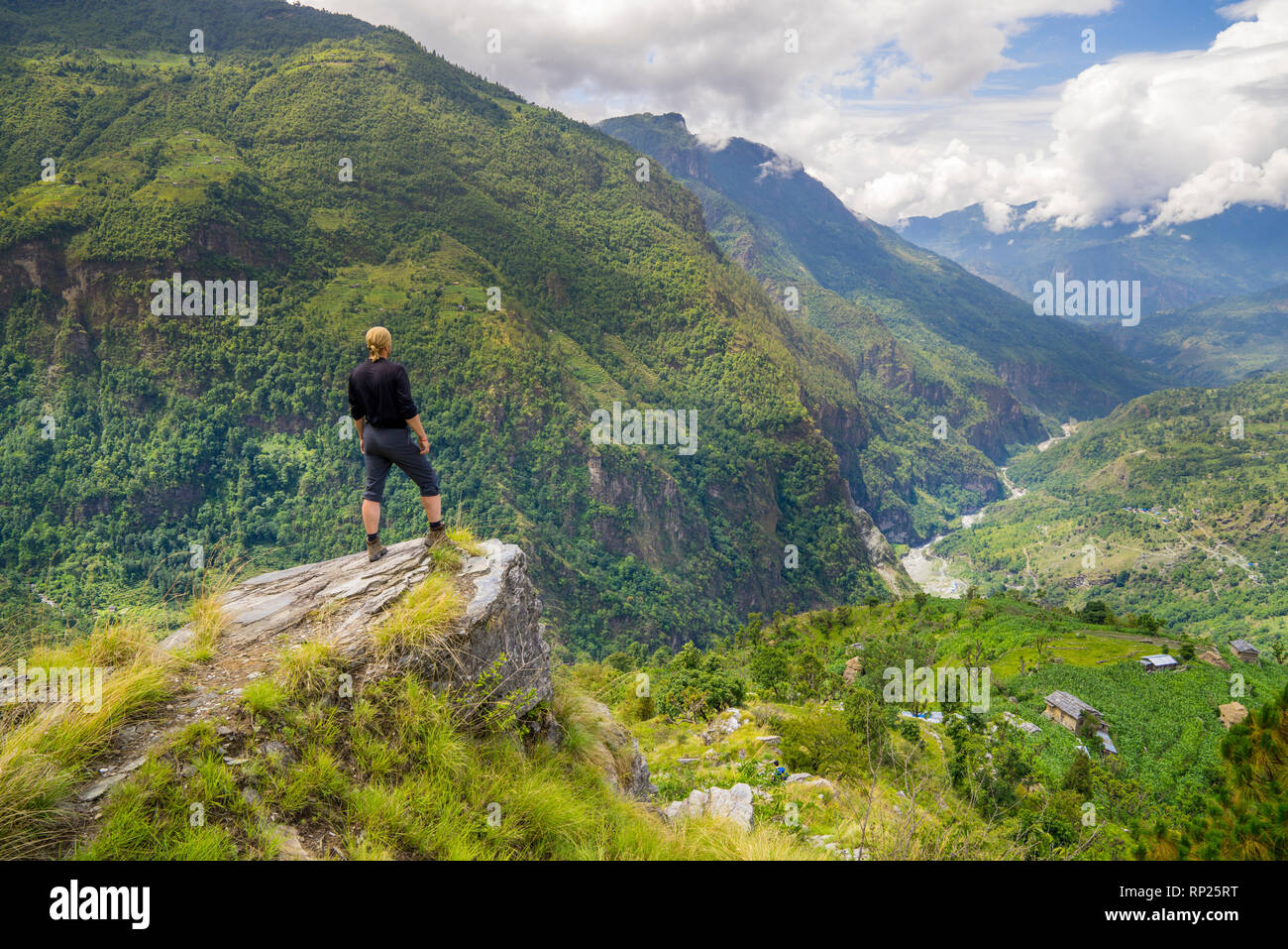 Man standing on top of the hill in Himalayas. Achievement and success ...