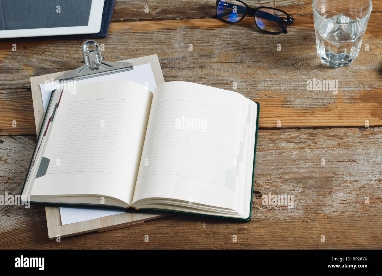 Home office desk with an open notebook Stock Photo - Alamy