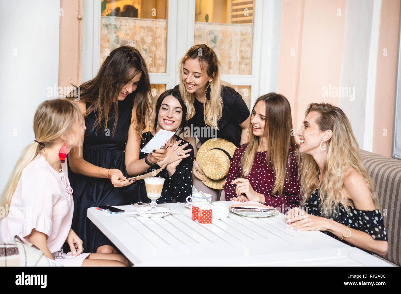 Six girls at the table Stock Photo - Alamy