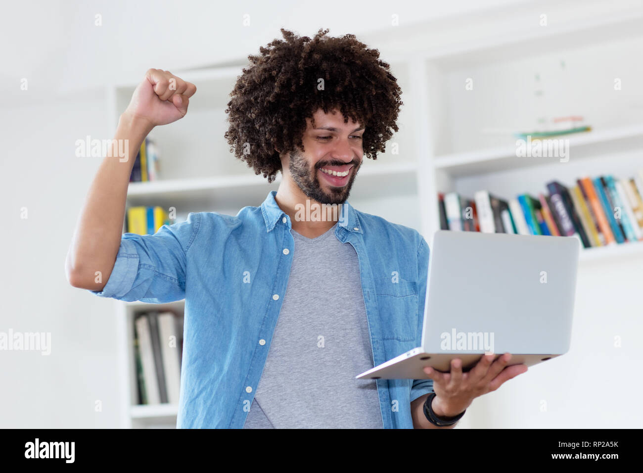 Person cheering with laptop hi-res stock photography and images - Alamy
