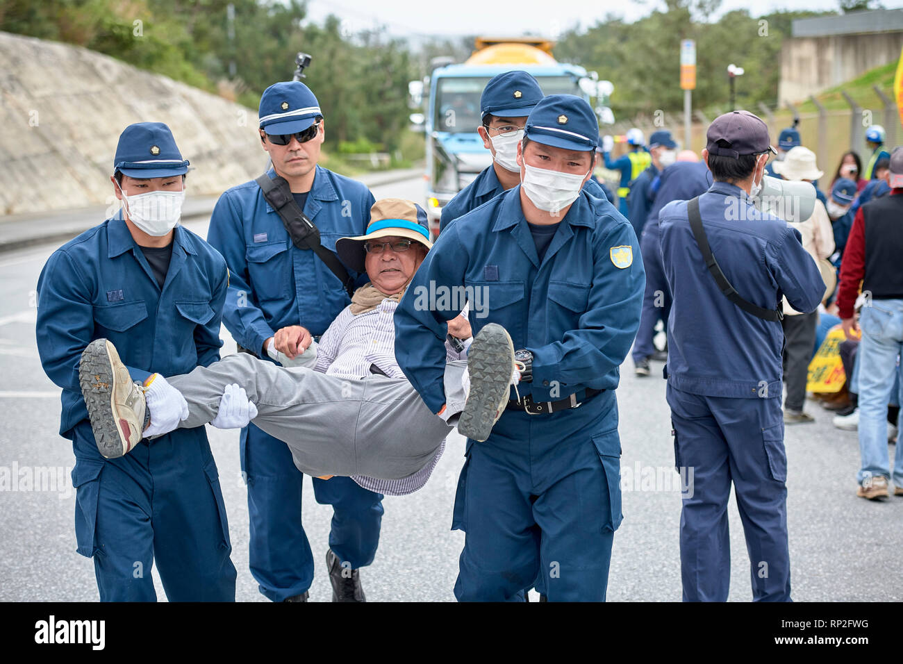 Henoko, Okinawa, Japan. 19th Feb, 2019. Police carry a man away from ...