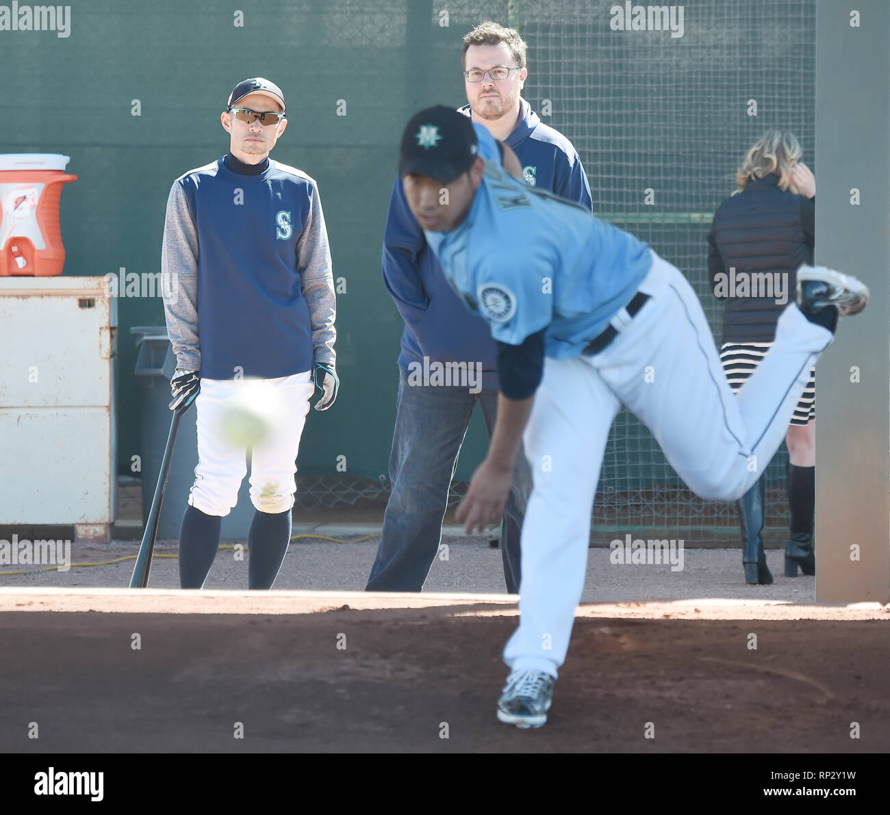 Ichiro Suzuki (L) of the Seattle Mariners watches as pitcher Yusei ...