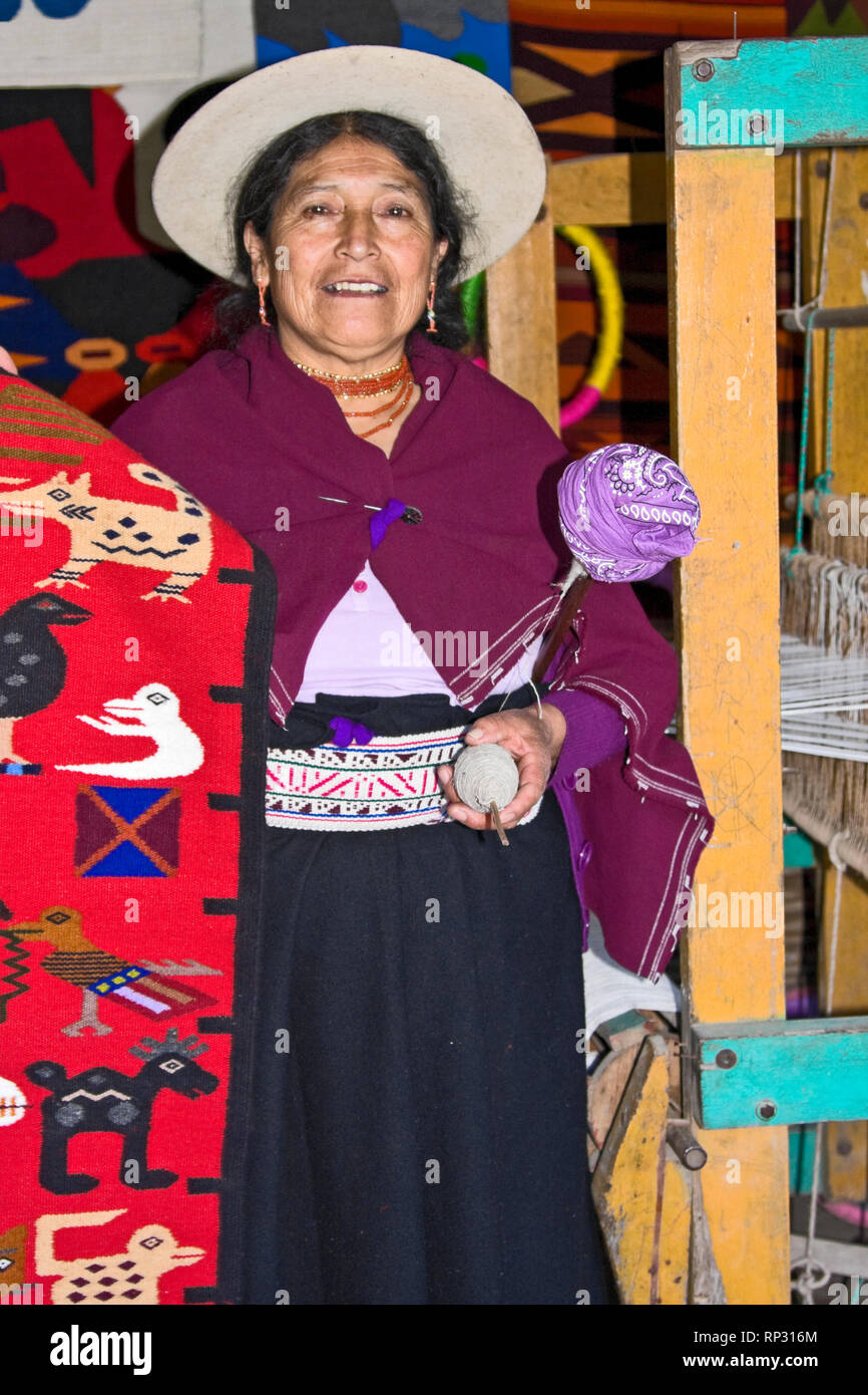 Indigenous woman, holding woven blanket; native designs; wool spinner ...
