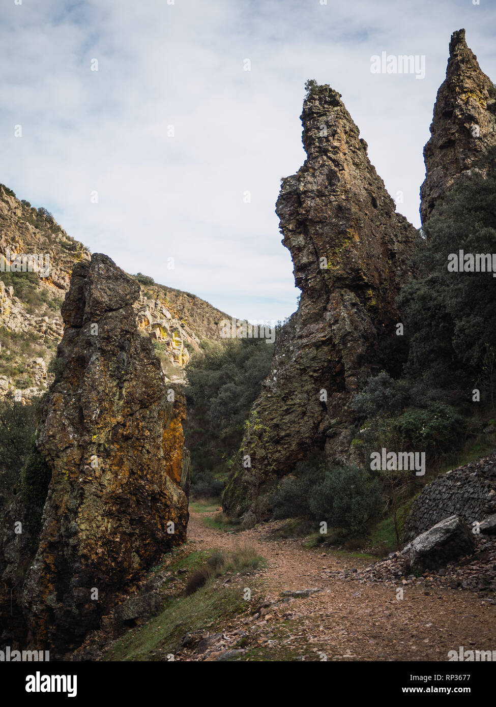 natural path up the mountain with cliffs on the sides Stock Photo - Alamy