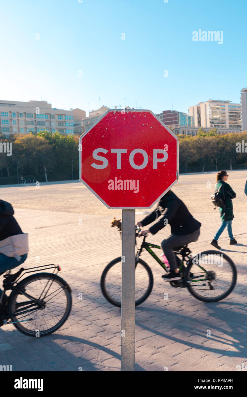 Red stop sign and bicycles on the background Stock Photo - Alamy