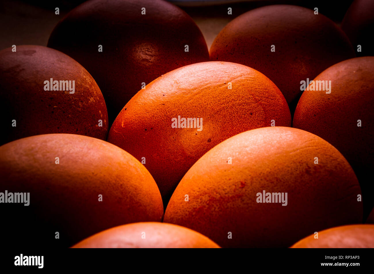 eggs colored with natural dye on brown dish, close-up Stock Photo - Alamy