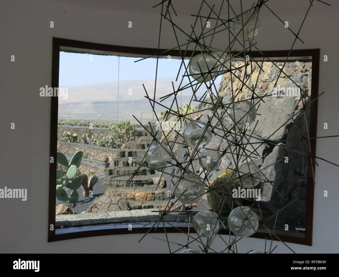 Close up of the abstract sculpture in front of the window looking out ...