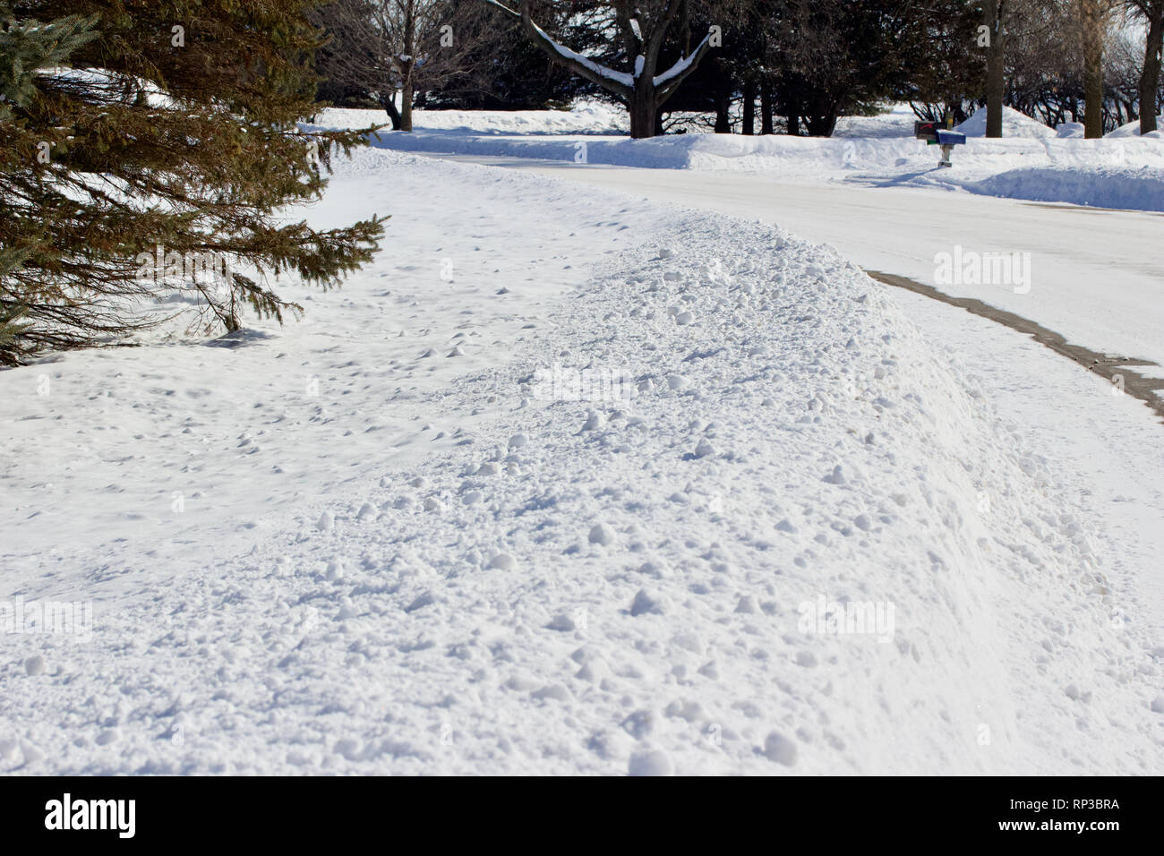 Close up abstract background view of white snow texture on a shoveled ...