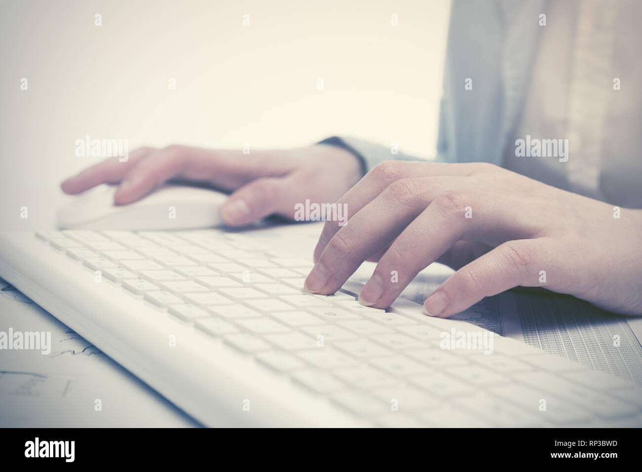 Business woman using computer mouse and keyboard Stock Photo - Alamy
