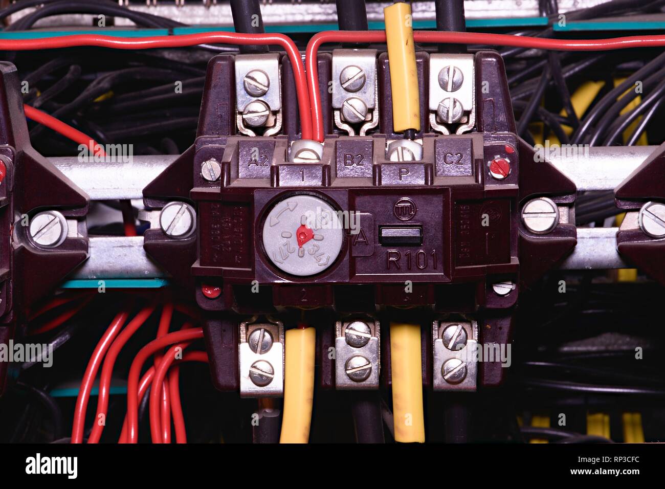 Old brown relay with wires. Closeup. Inside electric distribution case ...
