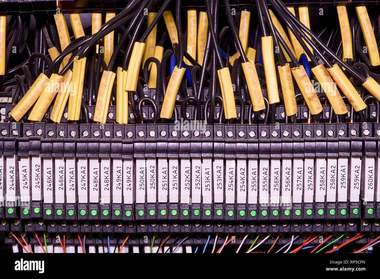 Modern terminal blocks with multi colored wires. Black wires with ...