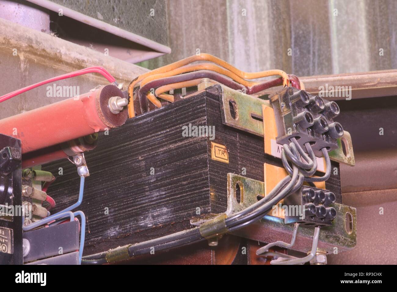 Old transformer inside electric distribution case. Closeup Stock Photo ...