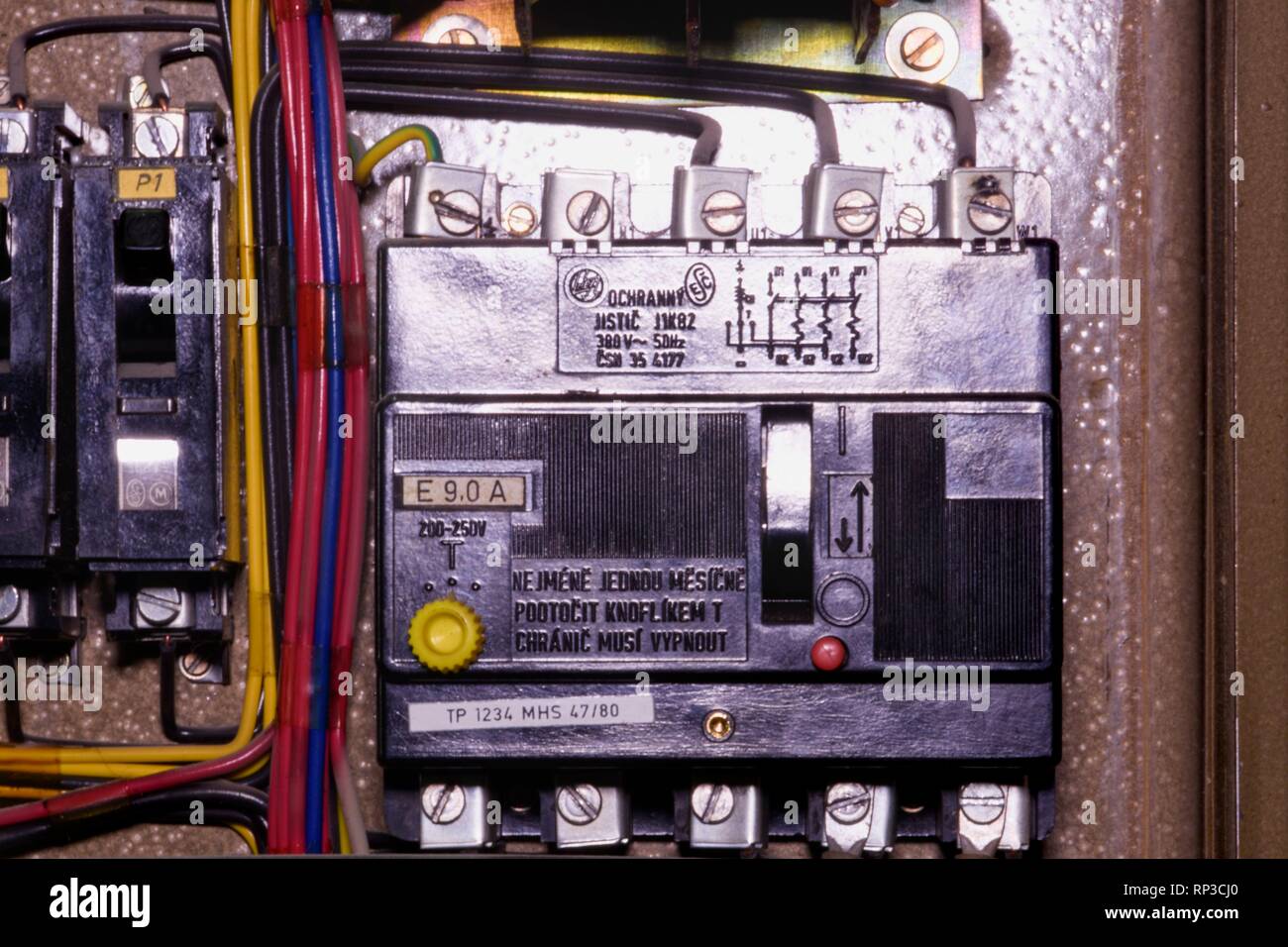 Old 3 phase circuit breaker in electric distribution case. Closeup ...