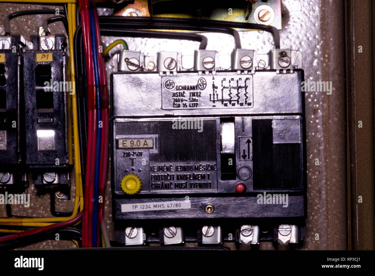 Old 3 phase circuit breaker in electric distribution case. Closeup ...