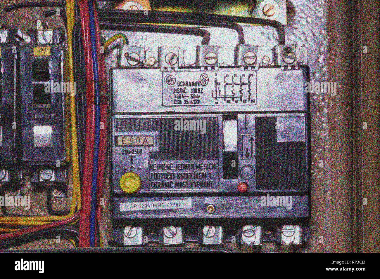 Old 3 phase circuit breaker in electric distribution case. Closeup. Add ...