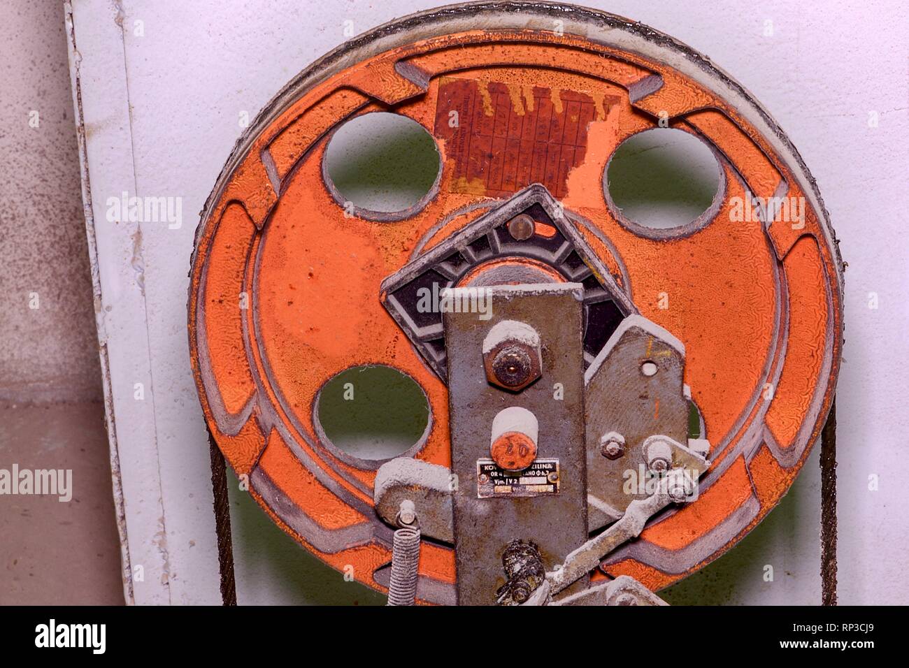 Part of industrial lift. Pulley wheel in engine room Stock Photo - Alamy