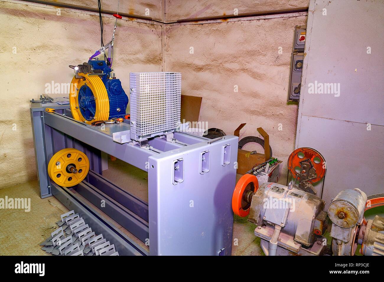 Part of industrial lift. Pulley wheel in engine room. Reconstruction of ...