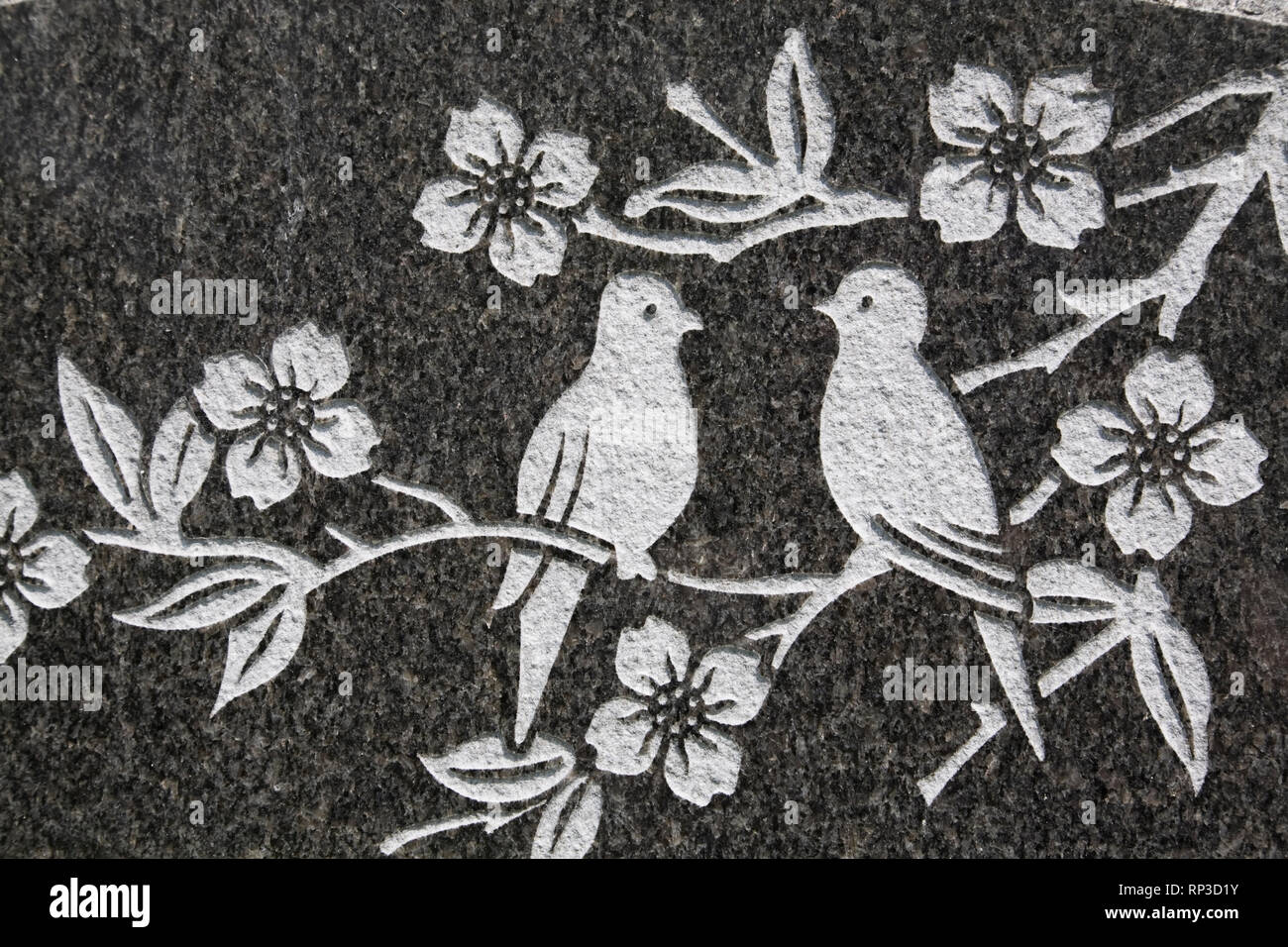 White doves depicted on a memorial monument in a cemetery Stock Photo ...