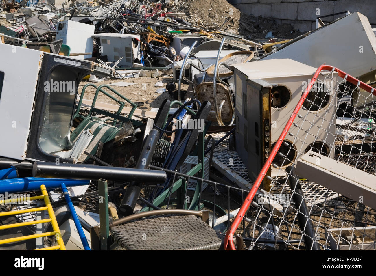 Pile of discarded household and industrial items at a scrap metal ...