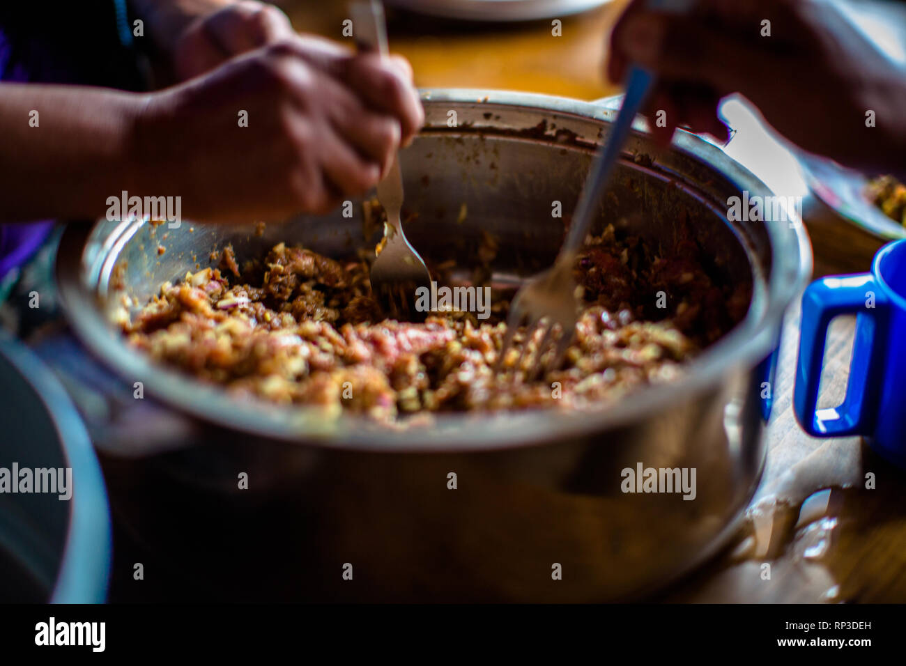 A rice and bean dish being prepared by a couple of Sherpa women Stock ...