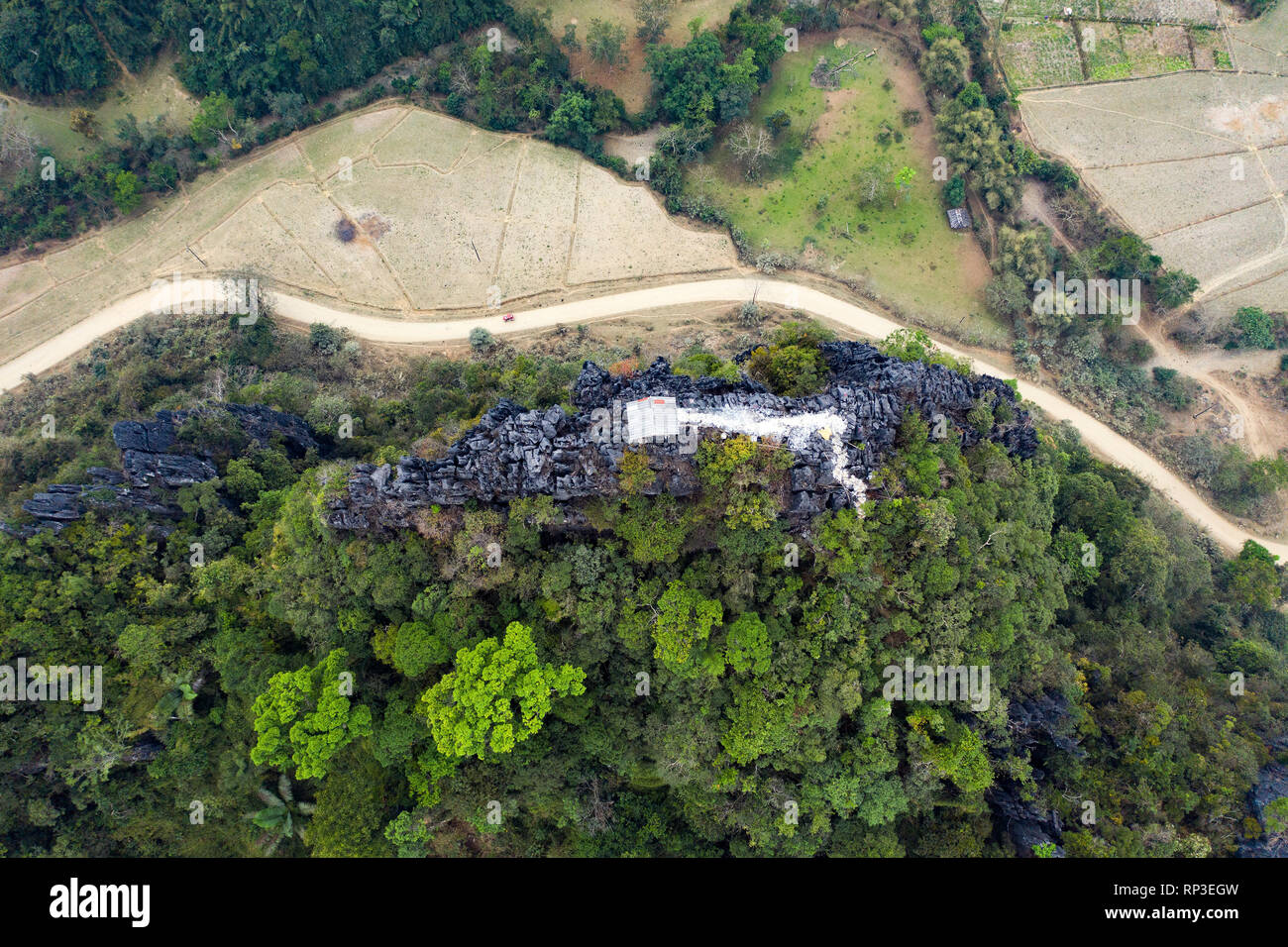 (View from above) Stunning aerial view of a beautiful little hut on top ...