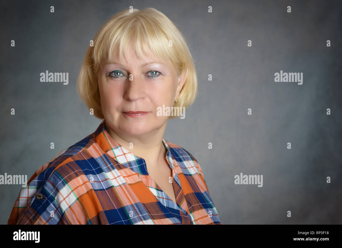 Middle aged woman portrait on dark background. Color toned image Stock ...