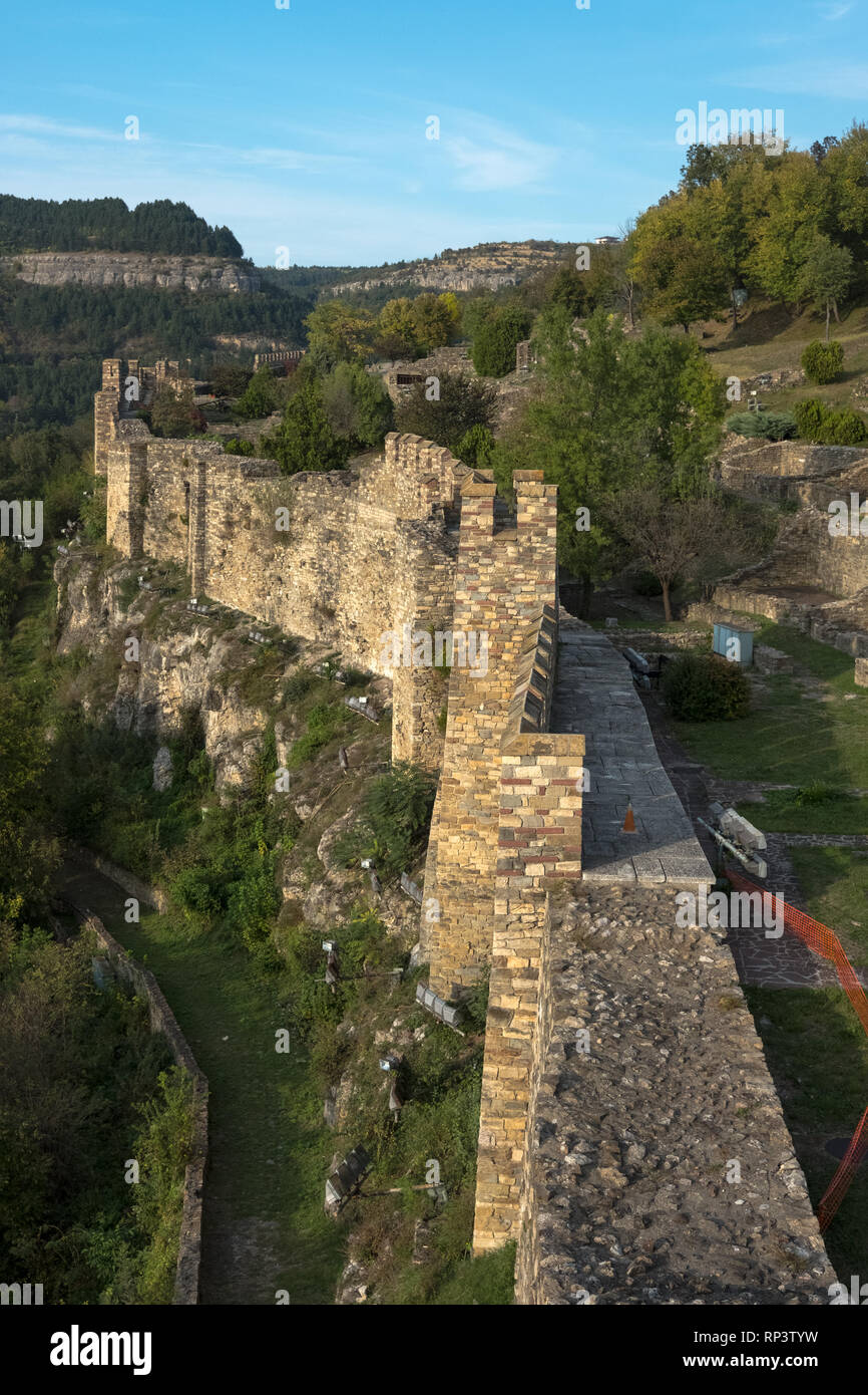 Looking down on defensive battlements built on top of a steep, craggy ...
