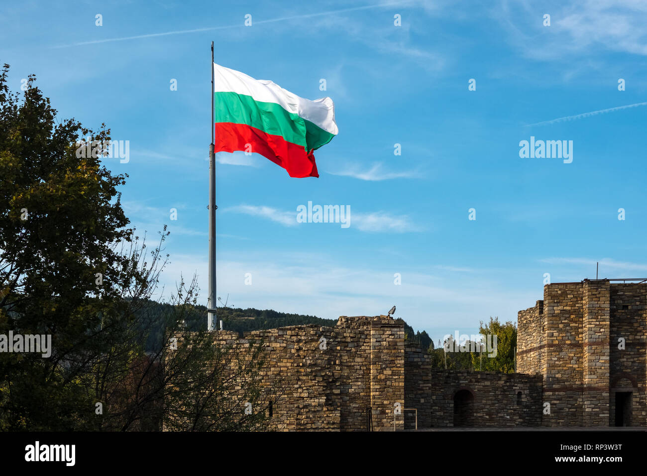 Bulgarian flag well illuminated with late afternoon sunshine flies from ...