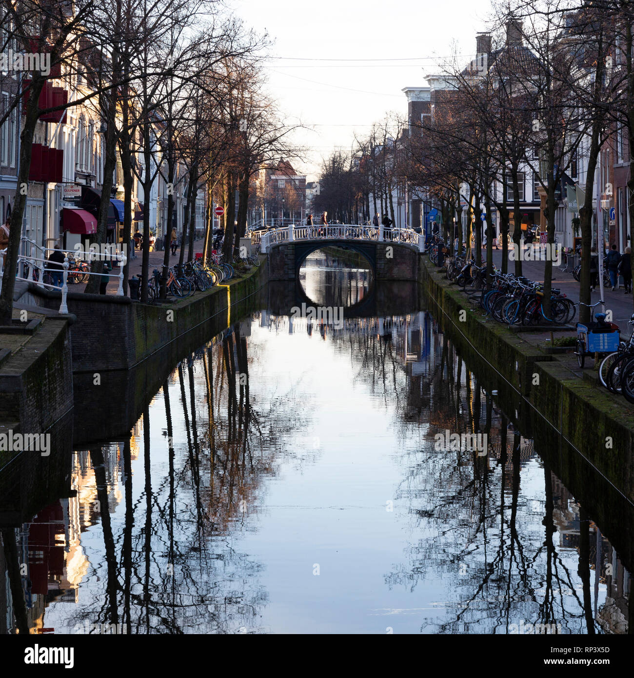 A birdge over the Oude Delft canal in Delft, the Netherlands. The canal ...