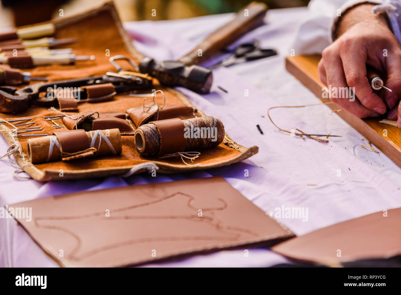 Artisans disguised in medieval times showing old crafts in a festival ...