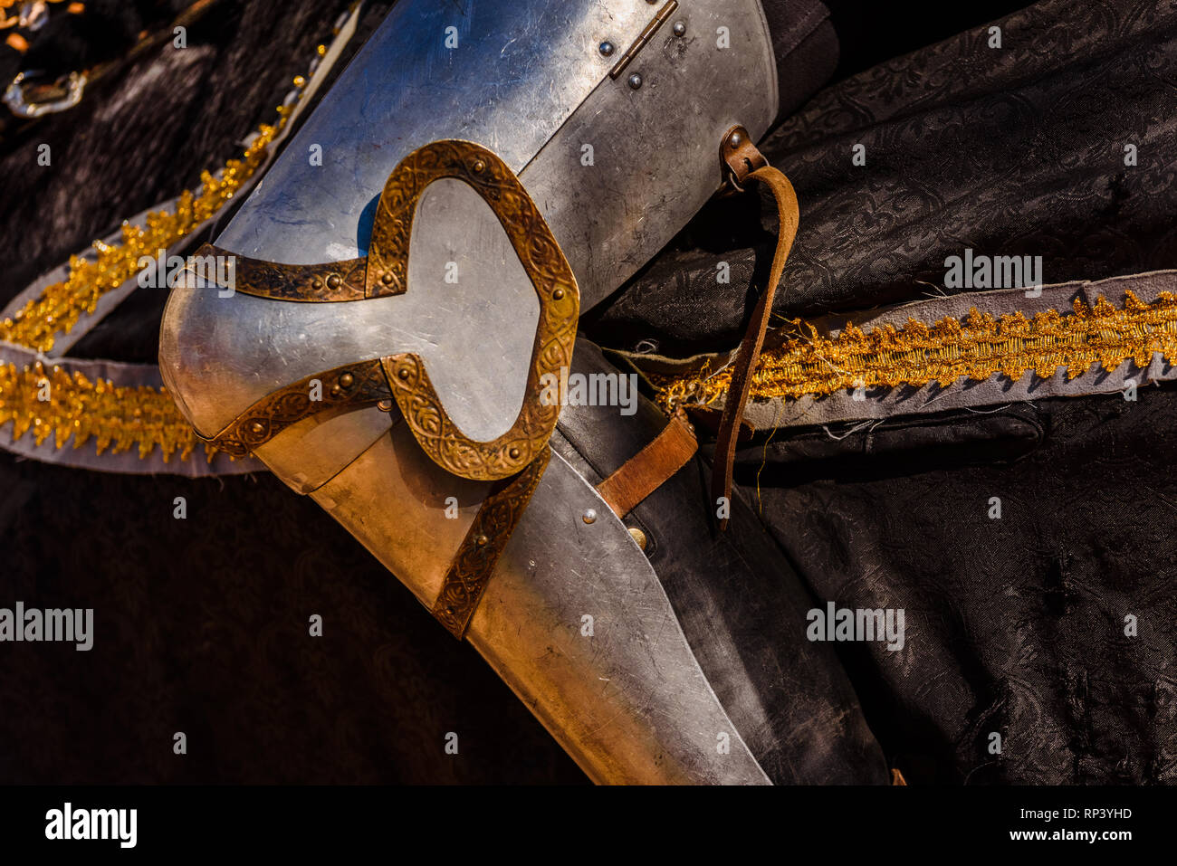 Detail of the armor of a knight mounted on horseback during a display ...