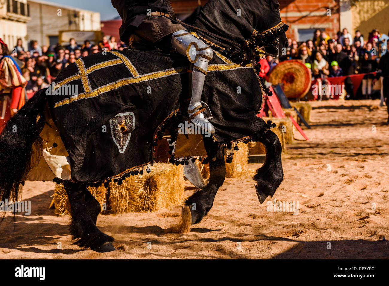 Detail of the armor of a knight mounted on horseback during a display ...