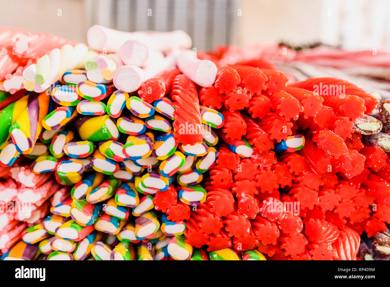 Elongated sweets of many colors Stock Photo - Alamy