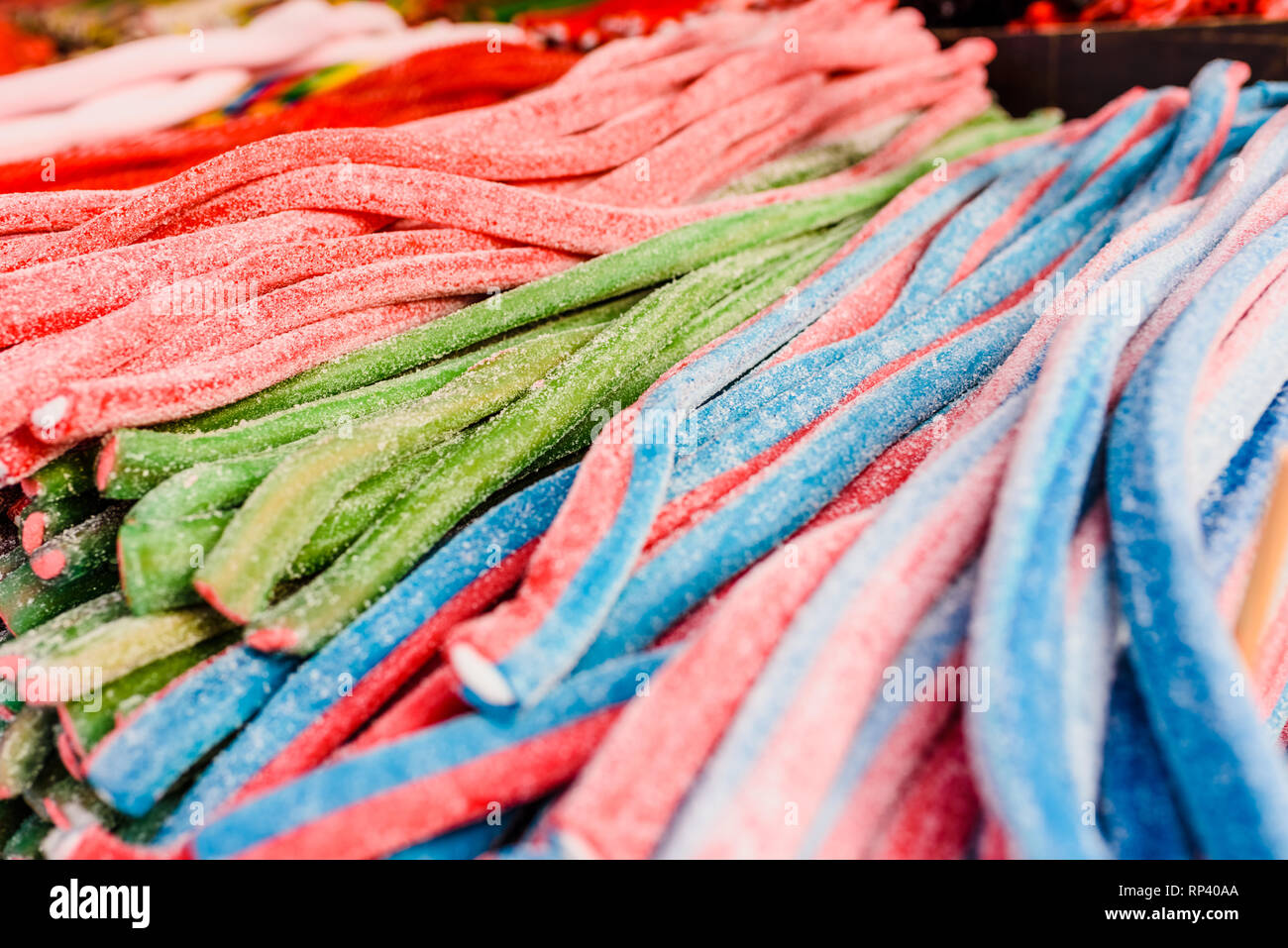 Elongated sweets of many colors Stock Photo - Alamy
