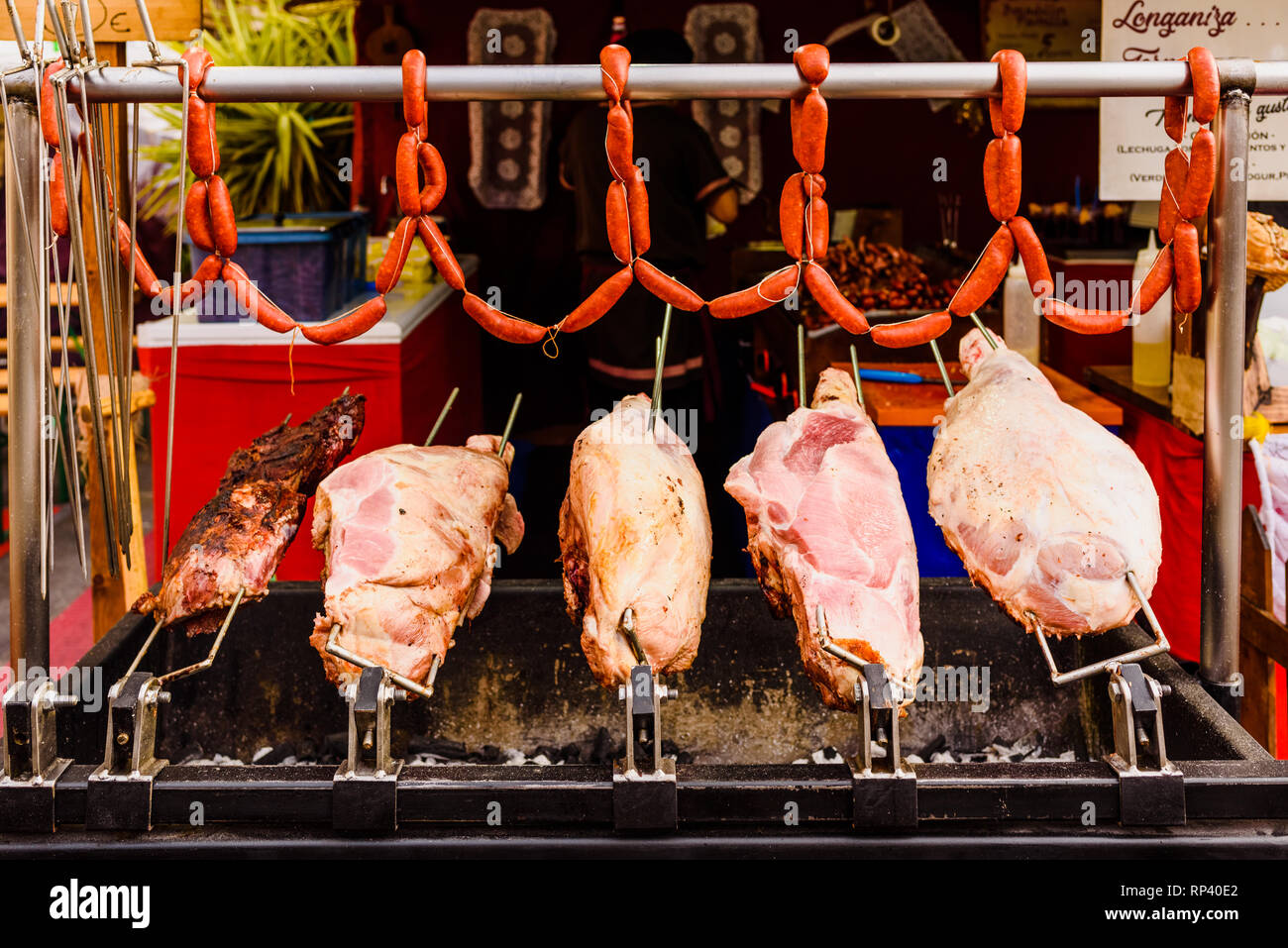 Whole pork hams roasting on a barbecue Stock Photo - Alamy