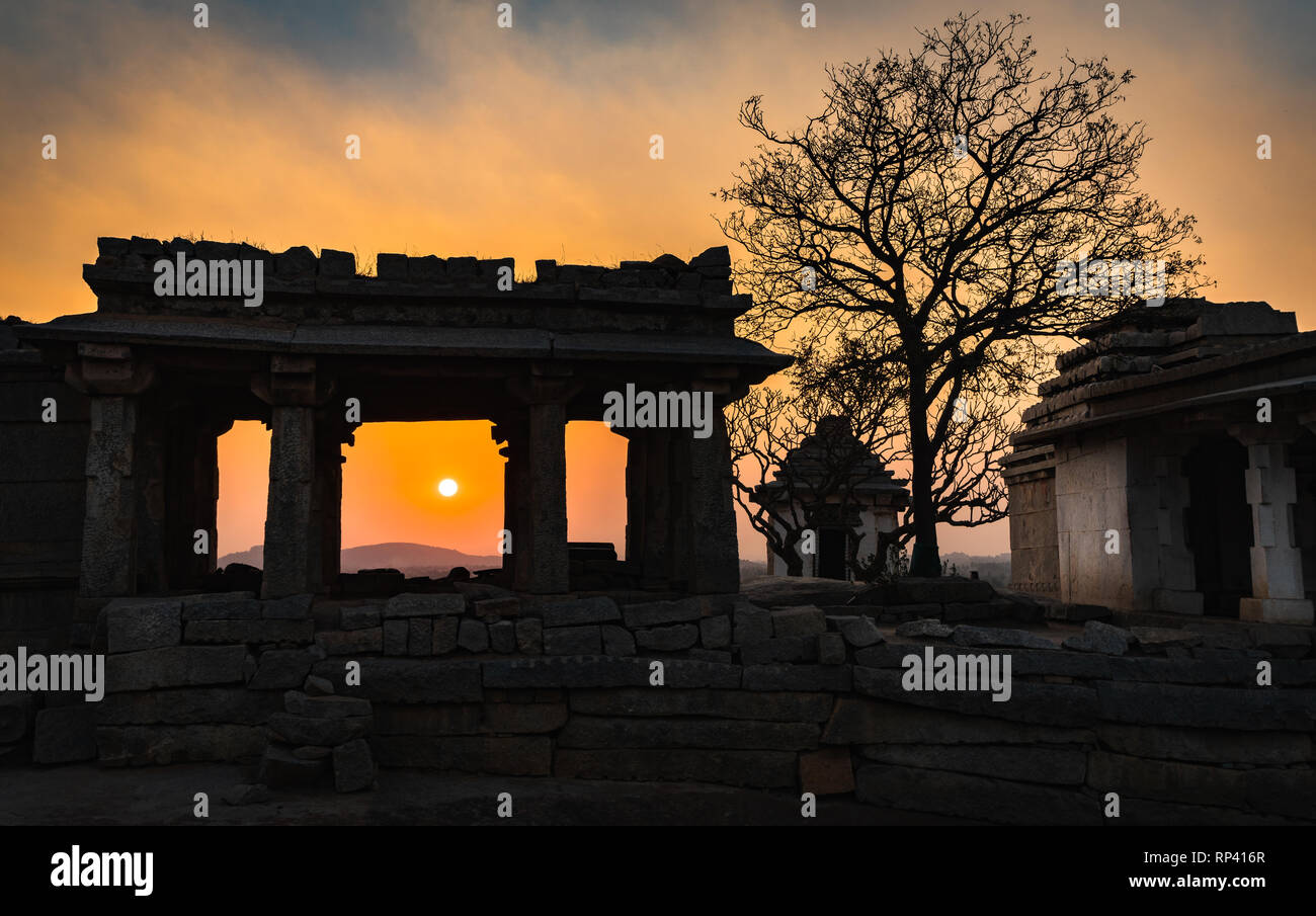 hampi karnakata india temple and silhouette tree at sunset point ...